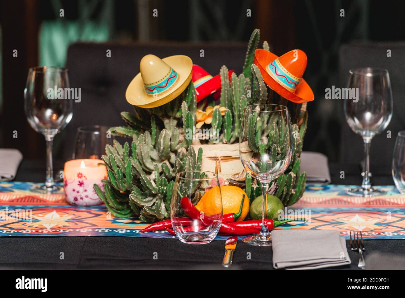 Mexican style decoration in a restaurant. Served table. Empty glasses ...