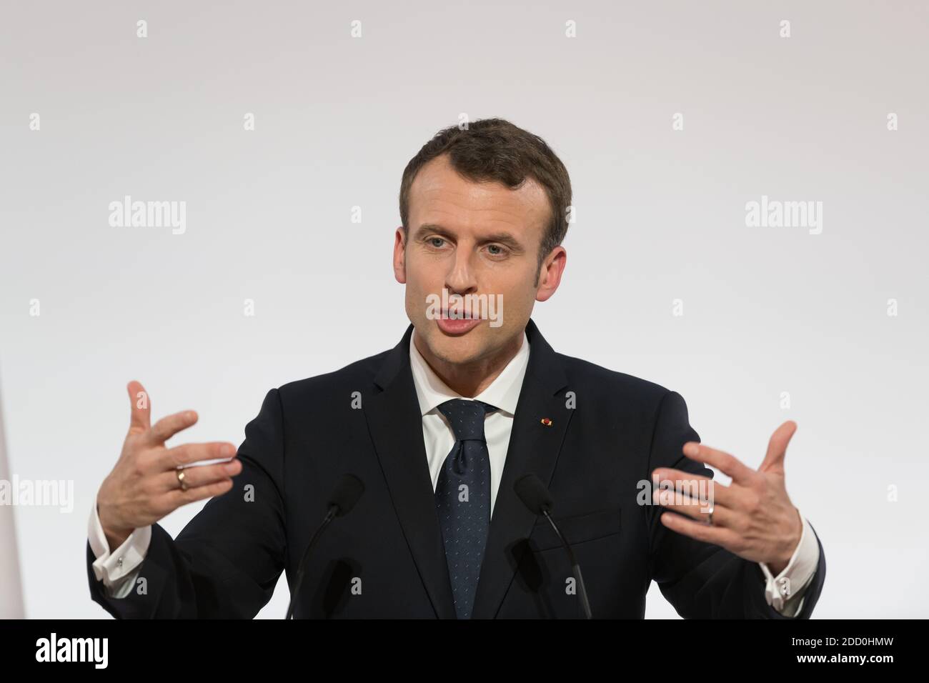 French President Emmanuel Macron looks on as he delivers his New Year ...