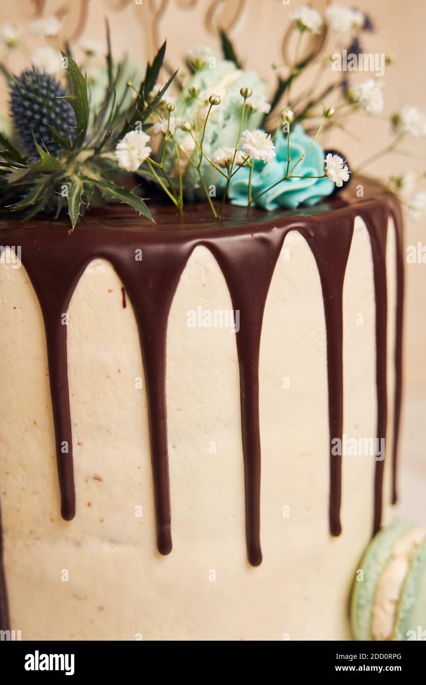 A closeup of a delicious drip cake with beautiful decorations Stock ...