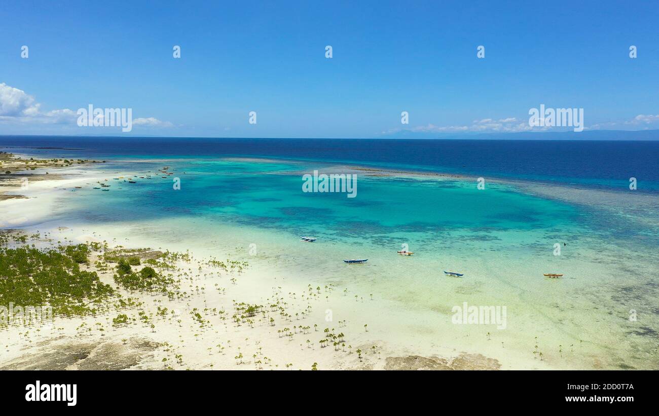 Aerial view of Lagoon with turquoise water and boats. Coral reef and ...