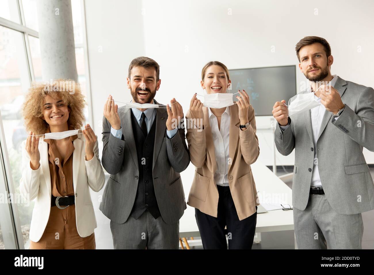 Business team taking off face hi-res stock photography and images - Alamy