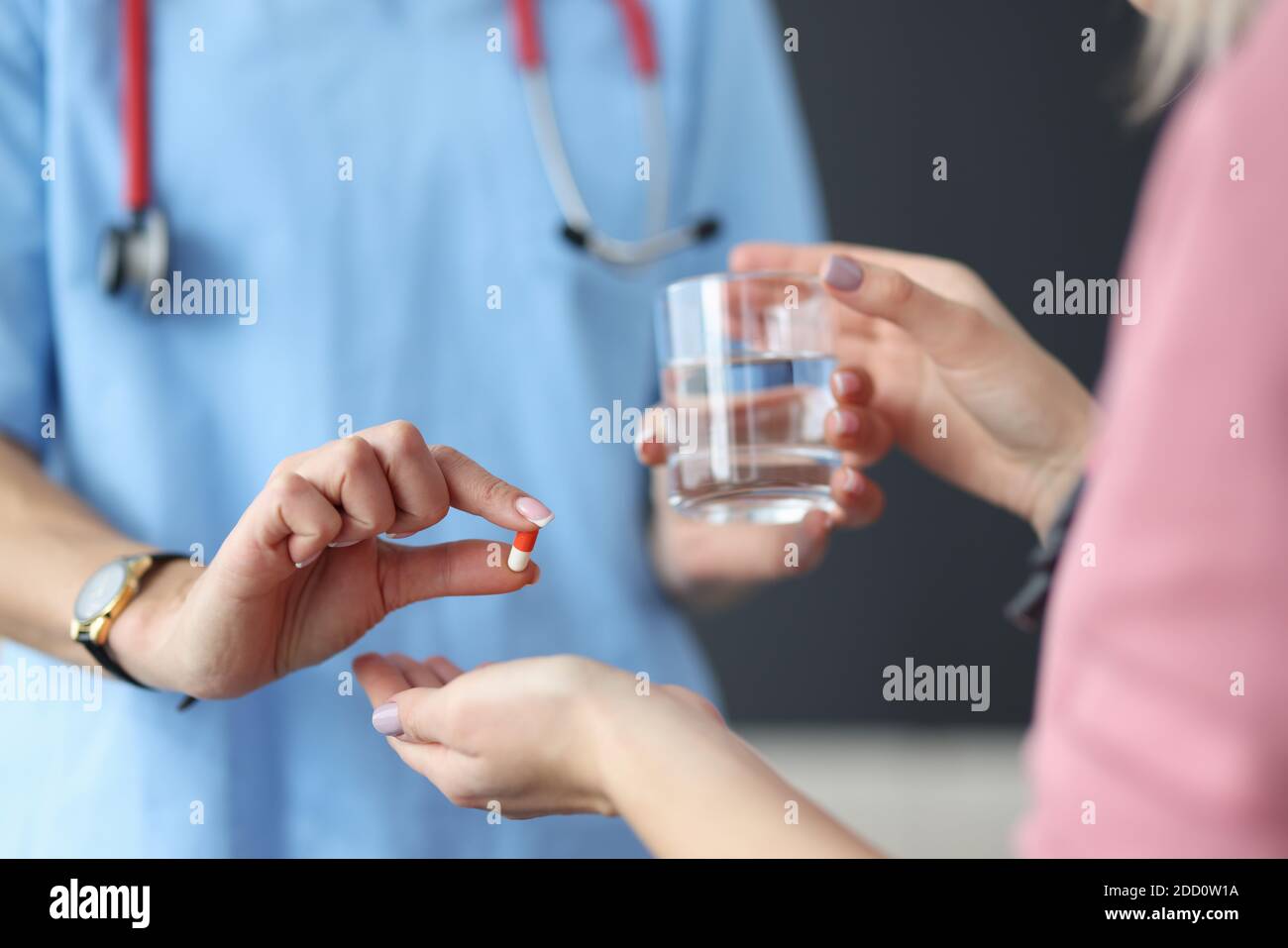 Doctor hands the patient pill and glass of water Stock Photo - Alamy