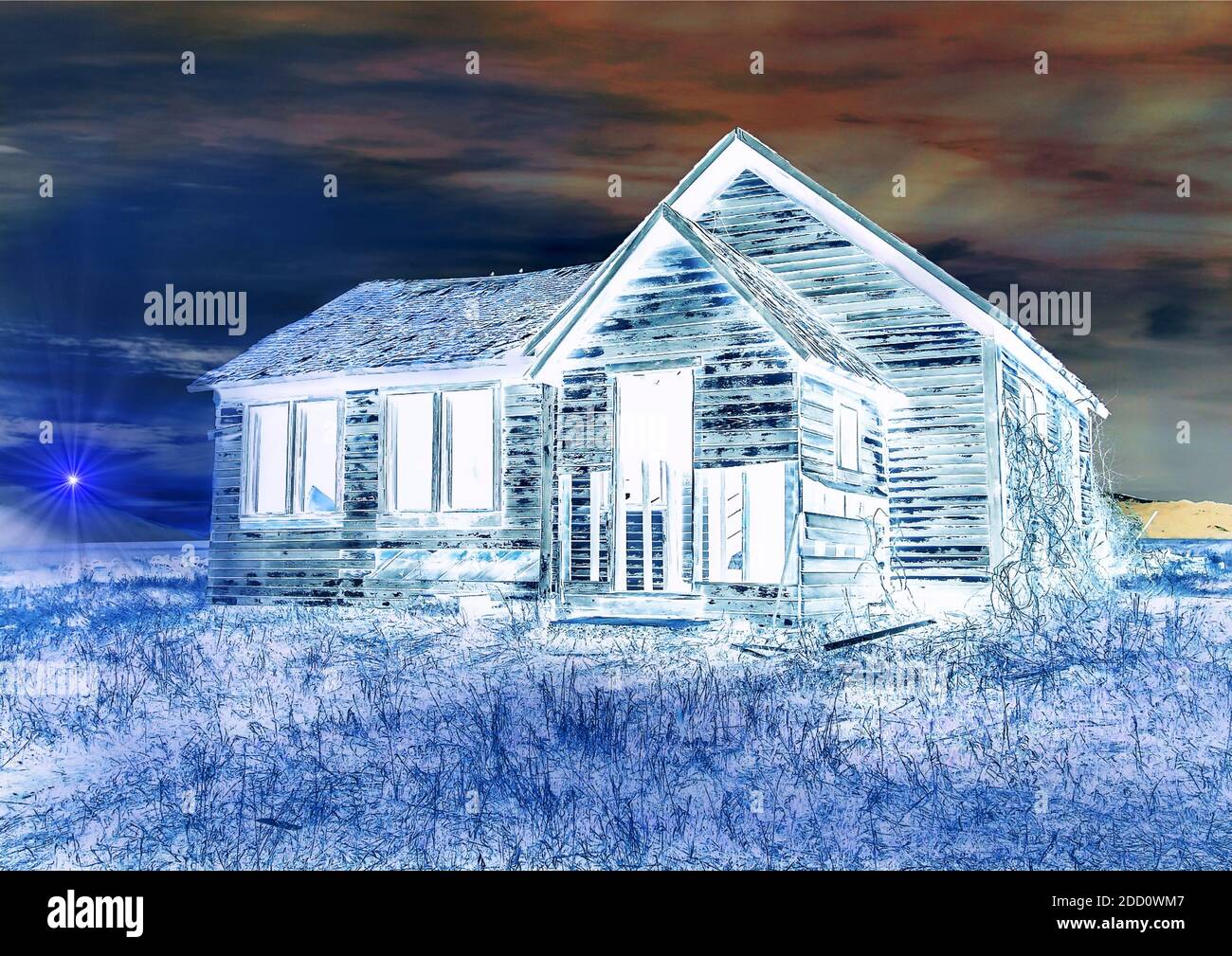 Old dilapidated wooden farmhouse with light shining from the west ...