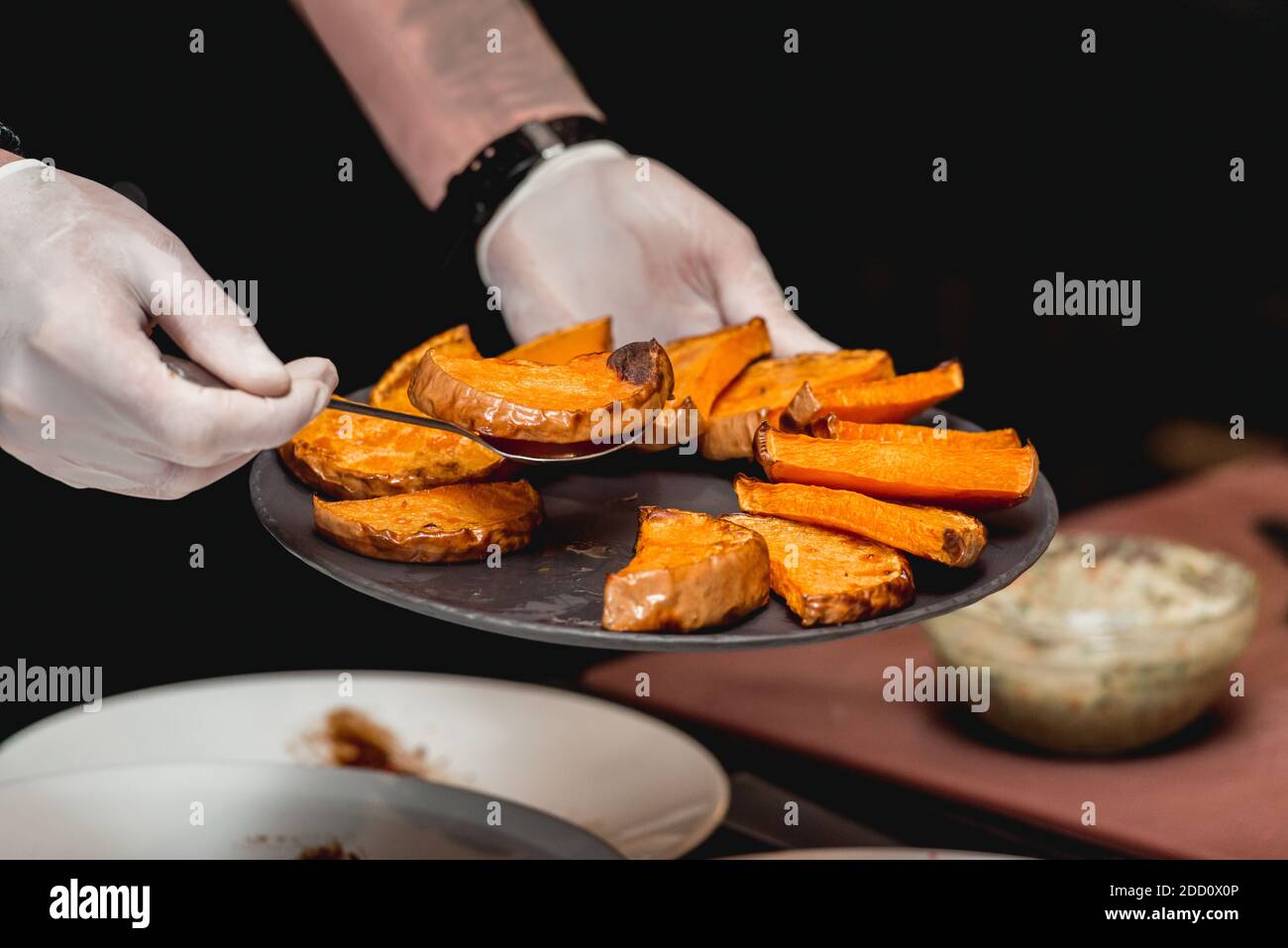 the chef makes a mexican dish. puts a sweet pumpkin on a plate. Day of ...