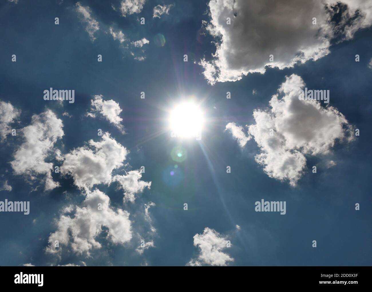clouds blue sky sun ray light natural background Stock Photo - Alamy