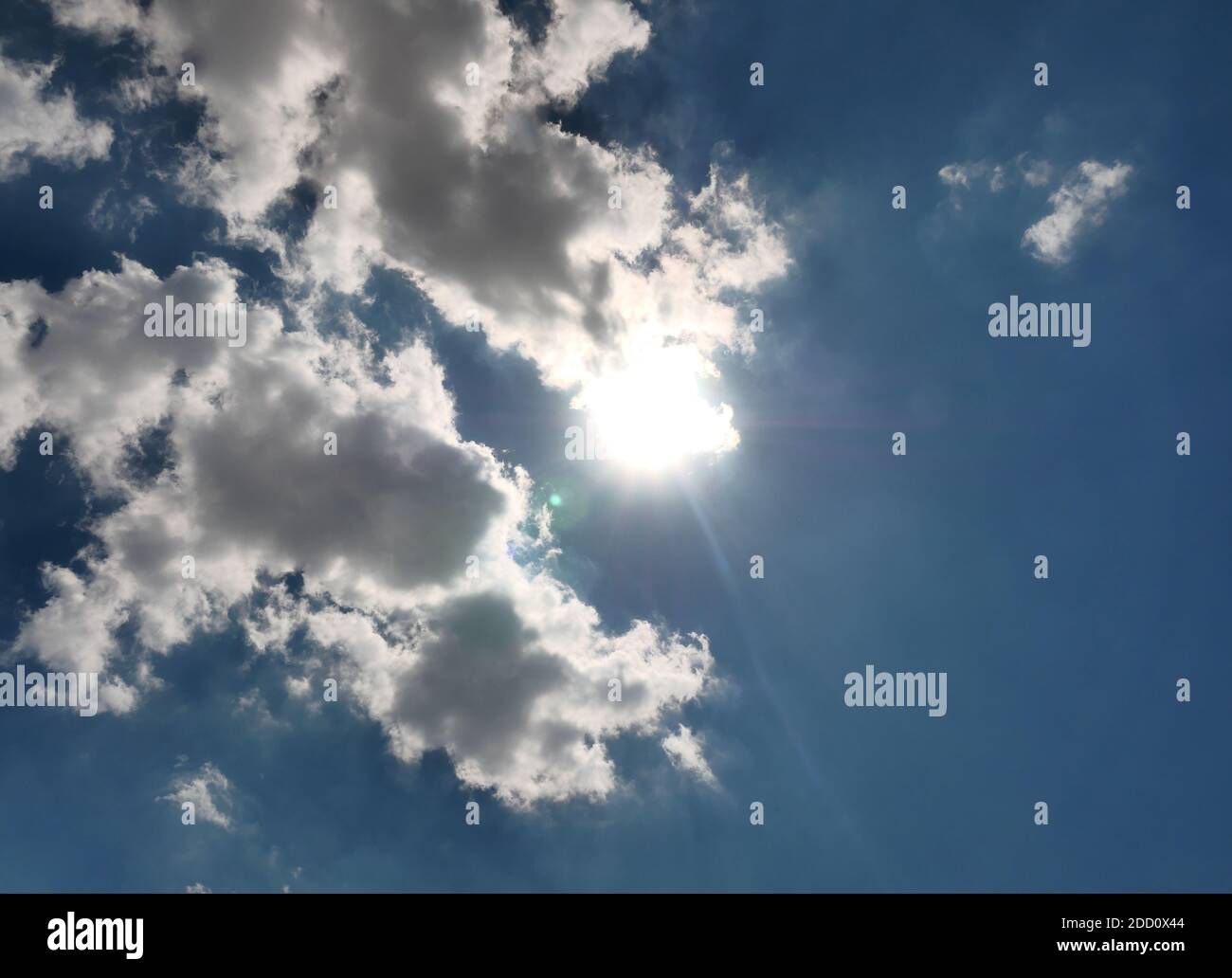 clouds blue sky sun ray light natural background Stock Photo - Alamy