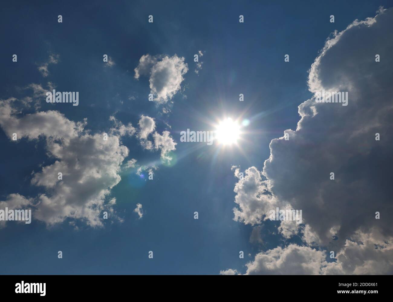 clouds blue sky sun ray light natural background Stock Photo - Alamy