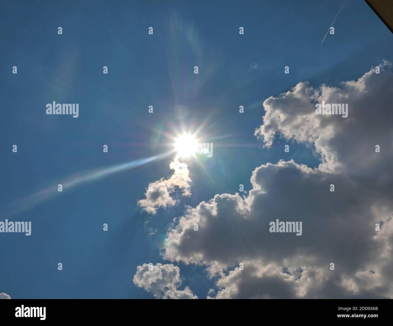 clouds blue sky sun ray light natural background Stock Photo - Alamy