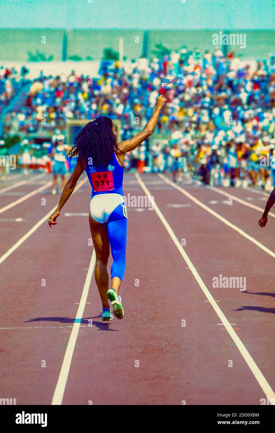Florence Griffith Joyner competing in the 100m at the 1988 U.S. Olympic ...