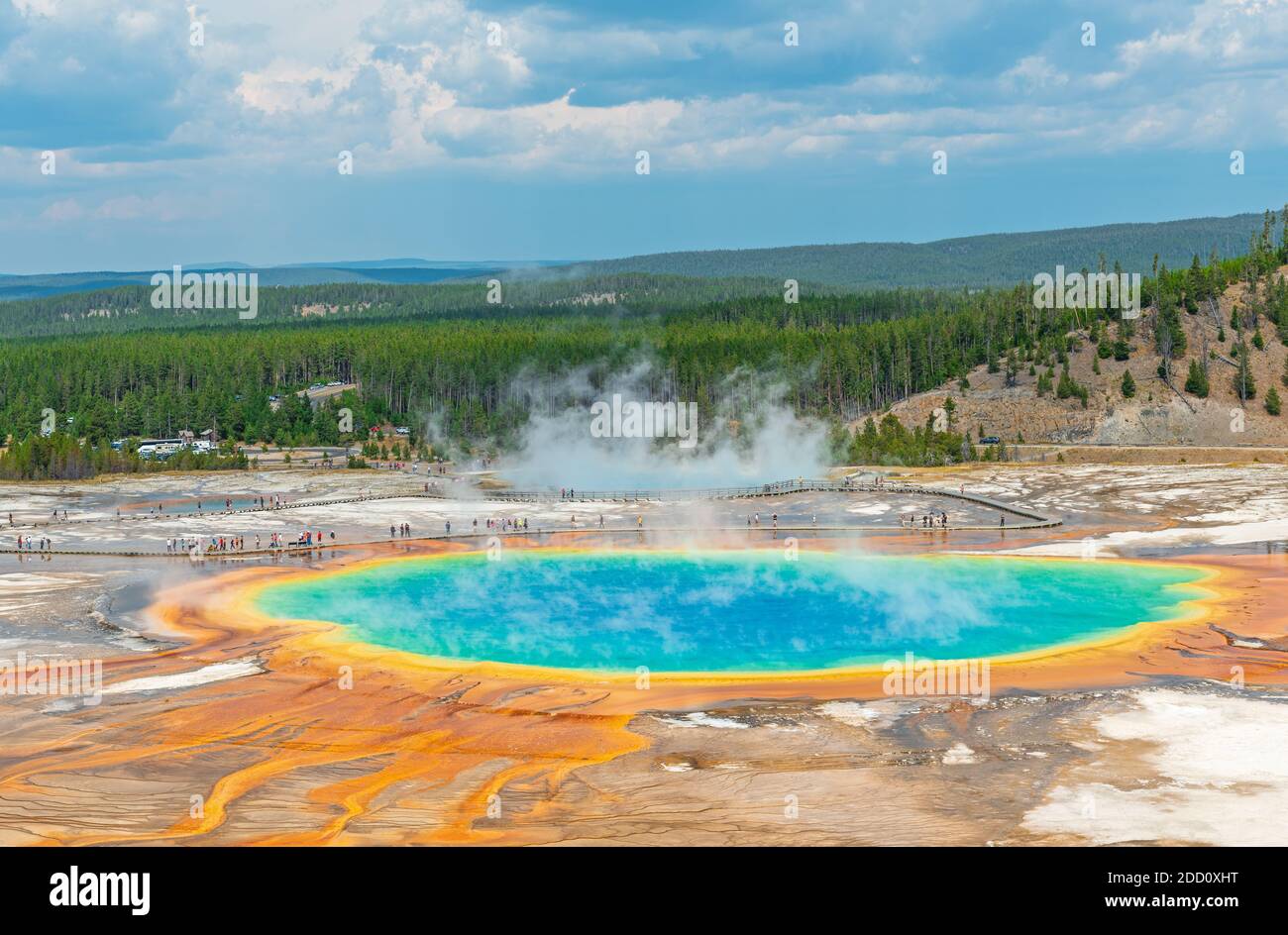 Aerial landscape of the Grand Prismatic Spring with elevated walkway and people walking ...