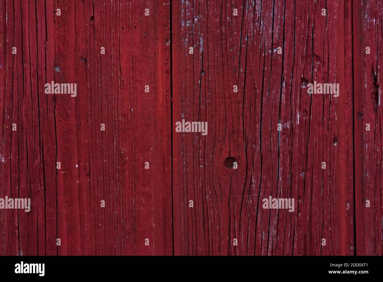 Red old wood wall from a barn painted in classic crimson red ...