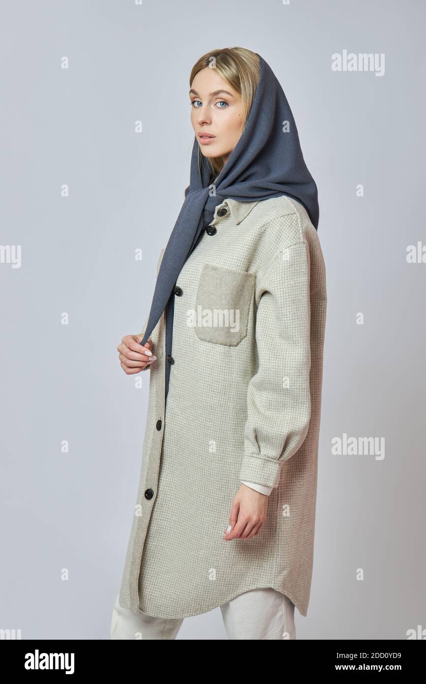 Beautiful woman with a winter scarf on her head. Clothing for cold ...