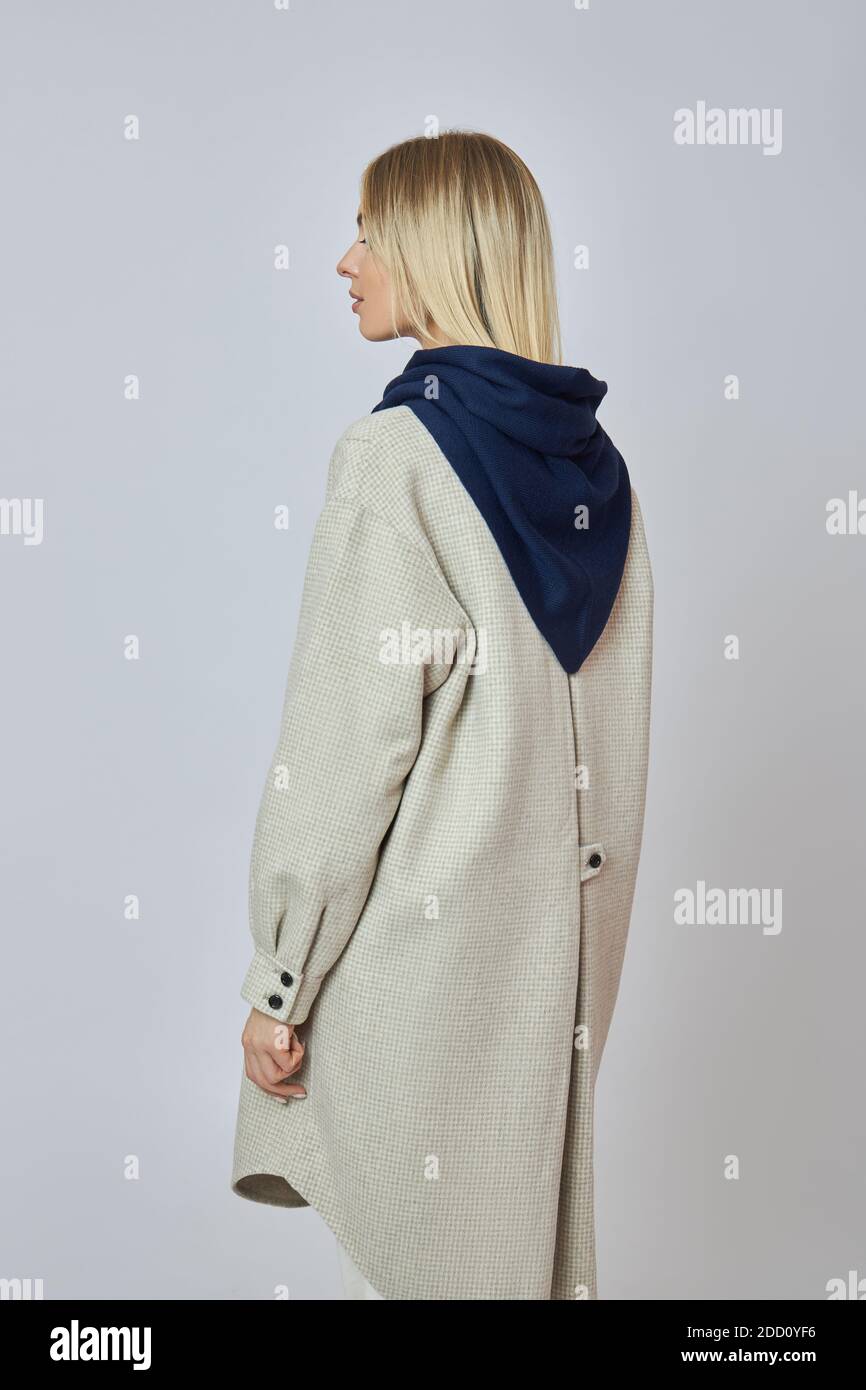 Beautiful woman with a winter scarf on her head. Clothing for cold ...