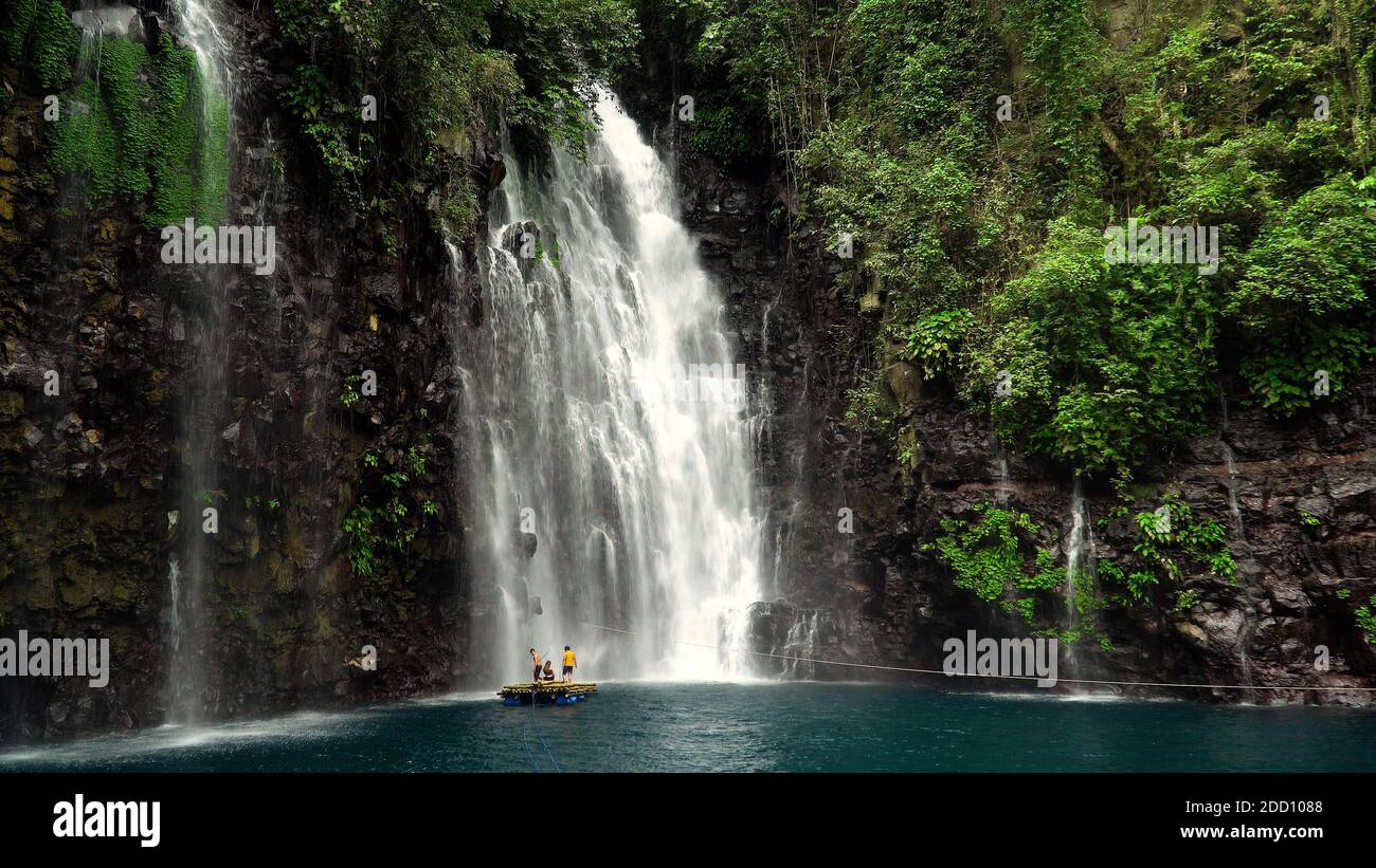 Waterfall in the jungle of the Philippines. Tinago Falls in the tropical forest. Iligan City ...