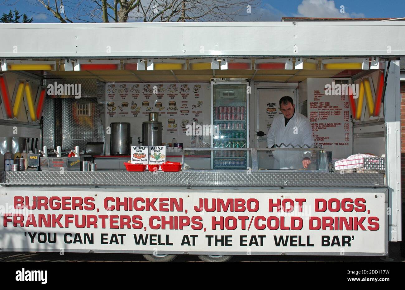 Hot dog stand. Owner cooking. Chichester Market, February. Chichester ...
