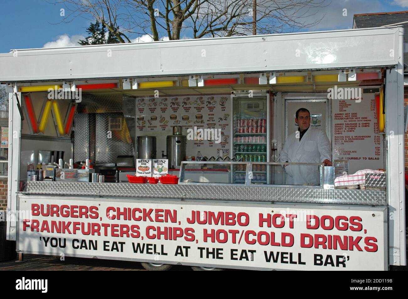 Hot dog stall. Owner standing waiting. Chichester Market. February ...