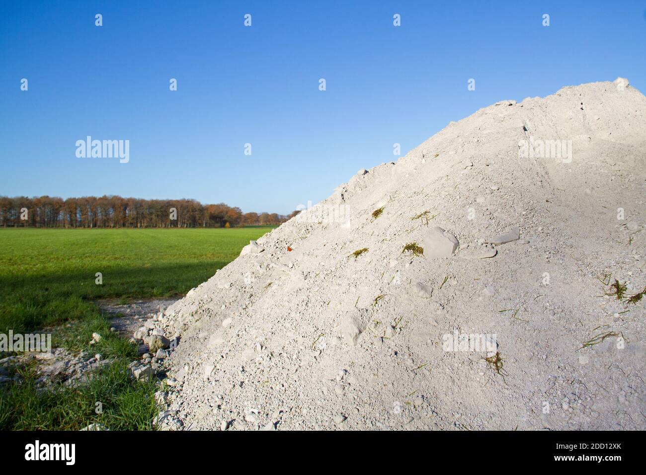 Heap of mineral fertilizer in the field, a concentrate obtained from ...