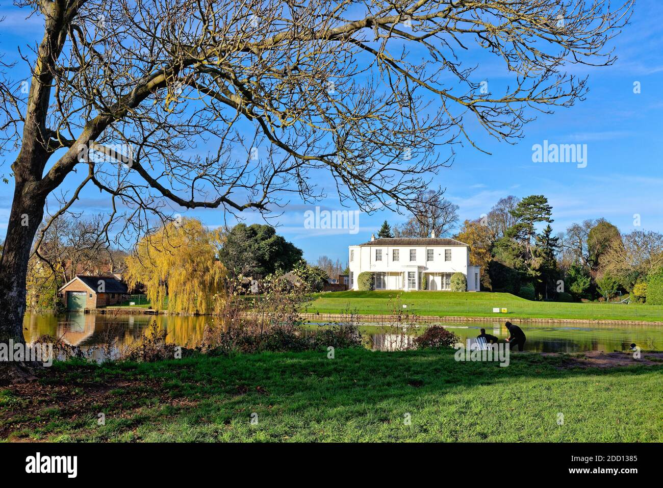 A large manor house by the River Thames at Shepperton on a sunny ...