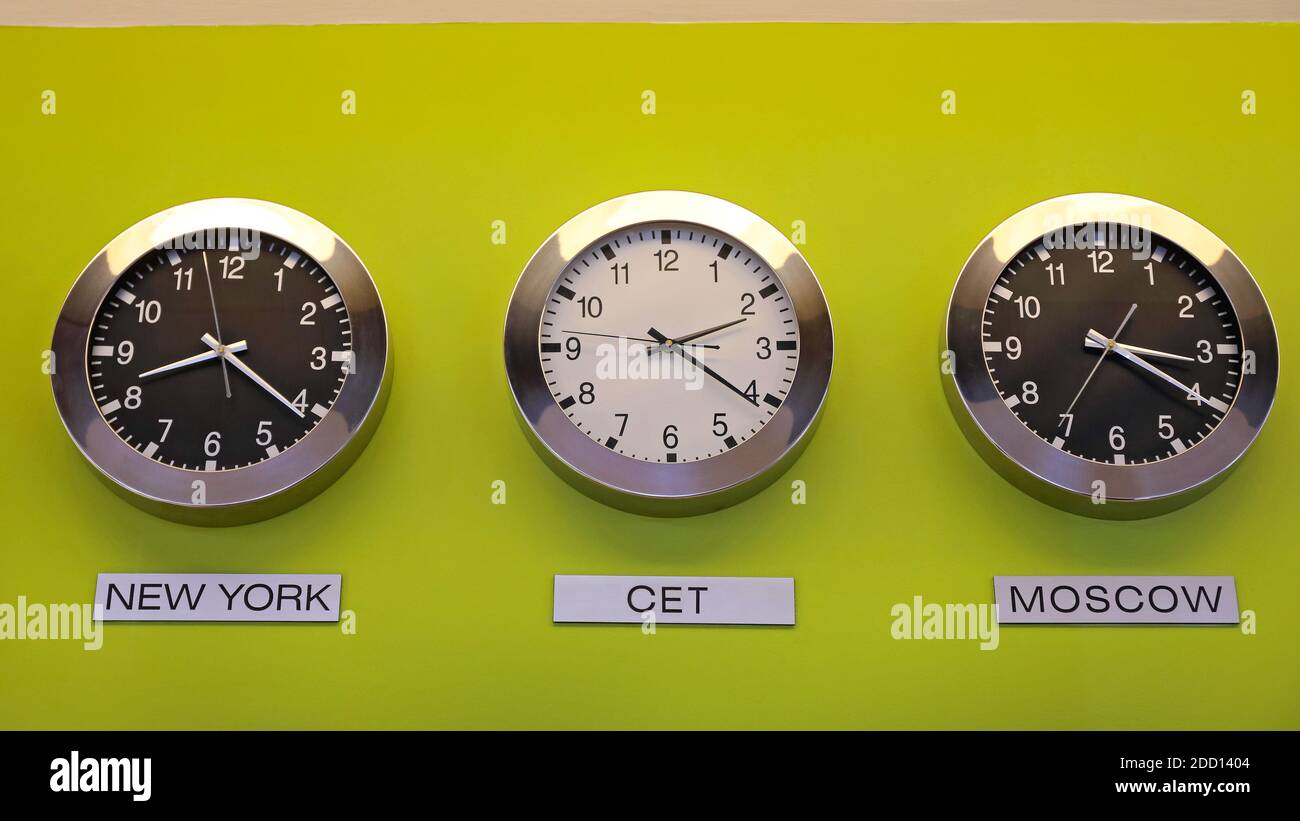 Central European Time Three Clocks at Wall Business Stock Photo - Alamy