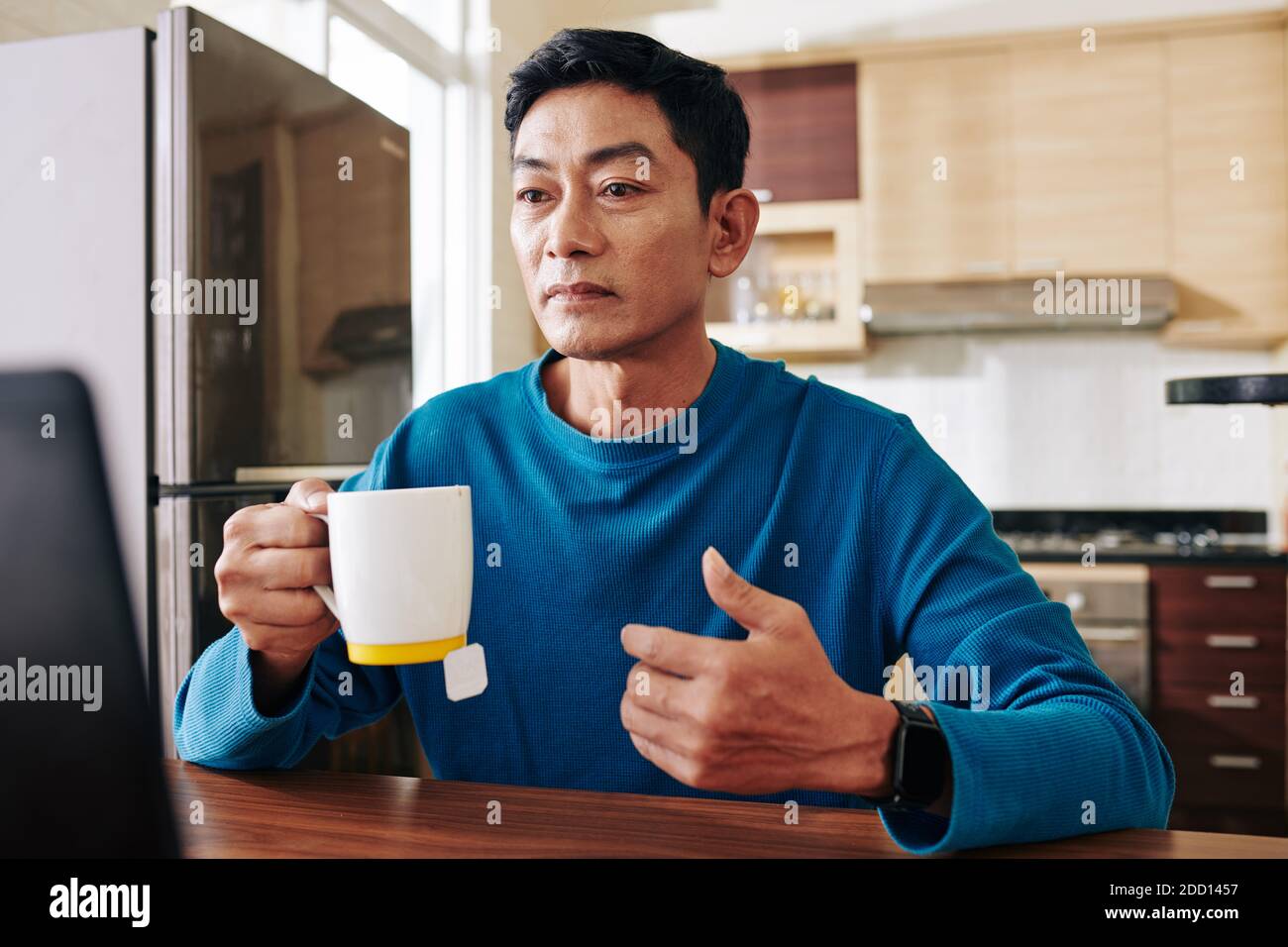 Man video calling his doctor Stock Photo - Alamy