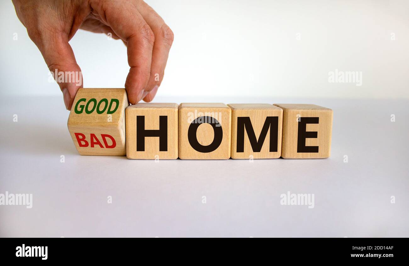 Bad home or good home. Hand turns a cube and changes the words 'bad ...
