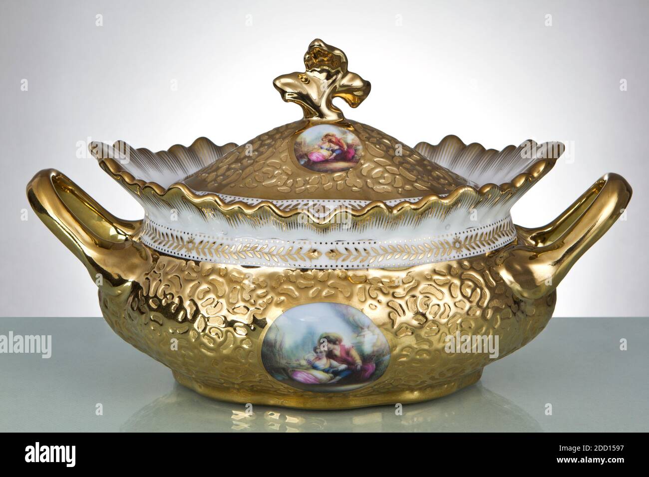Delicate golden porcelain on Dramatic modern background Stock Photo - Alamy