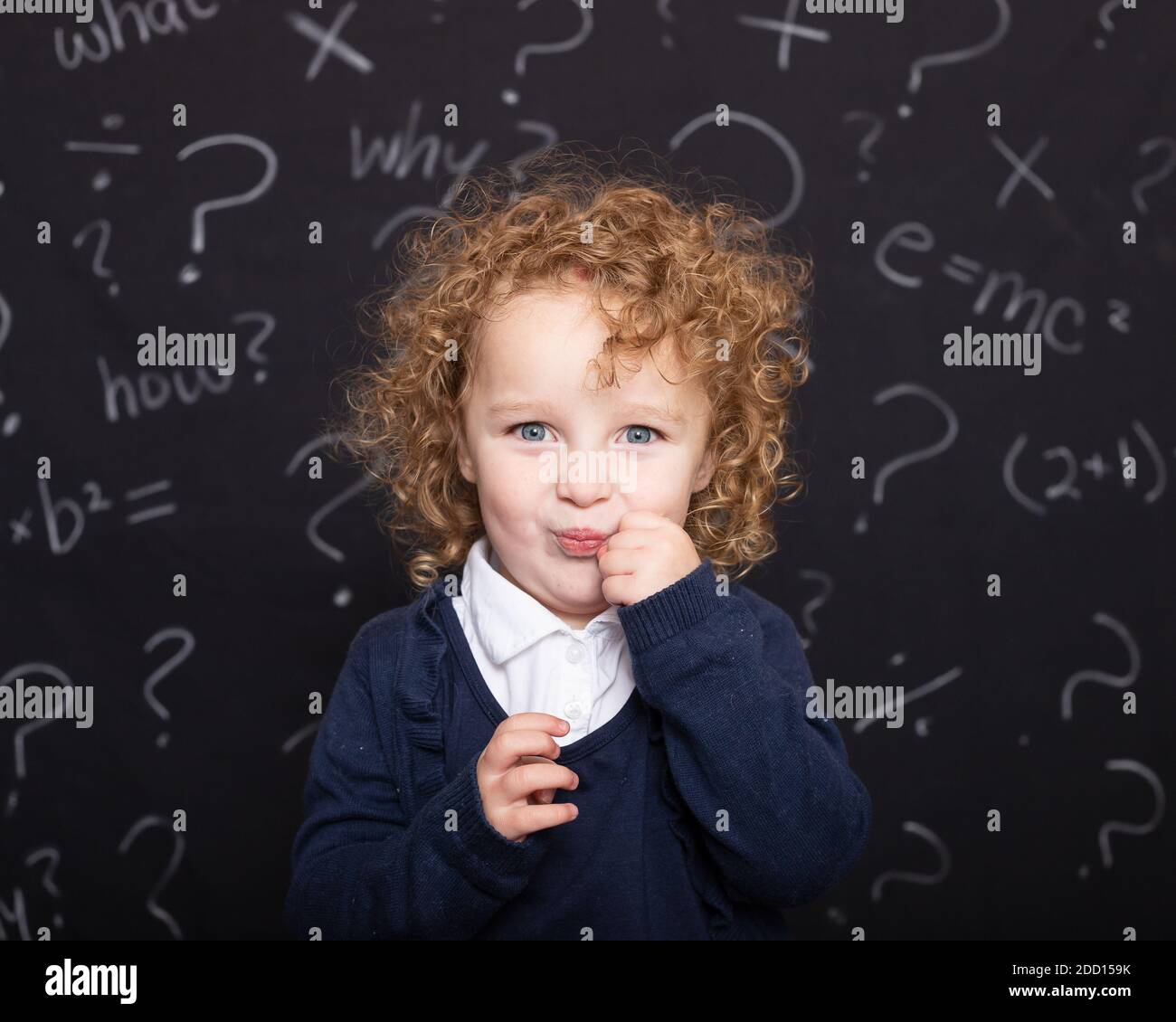 child toddler 3 year old dressed as a teacher and thinking with chalk ...