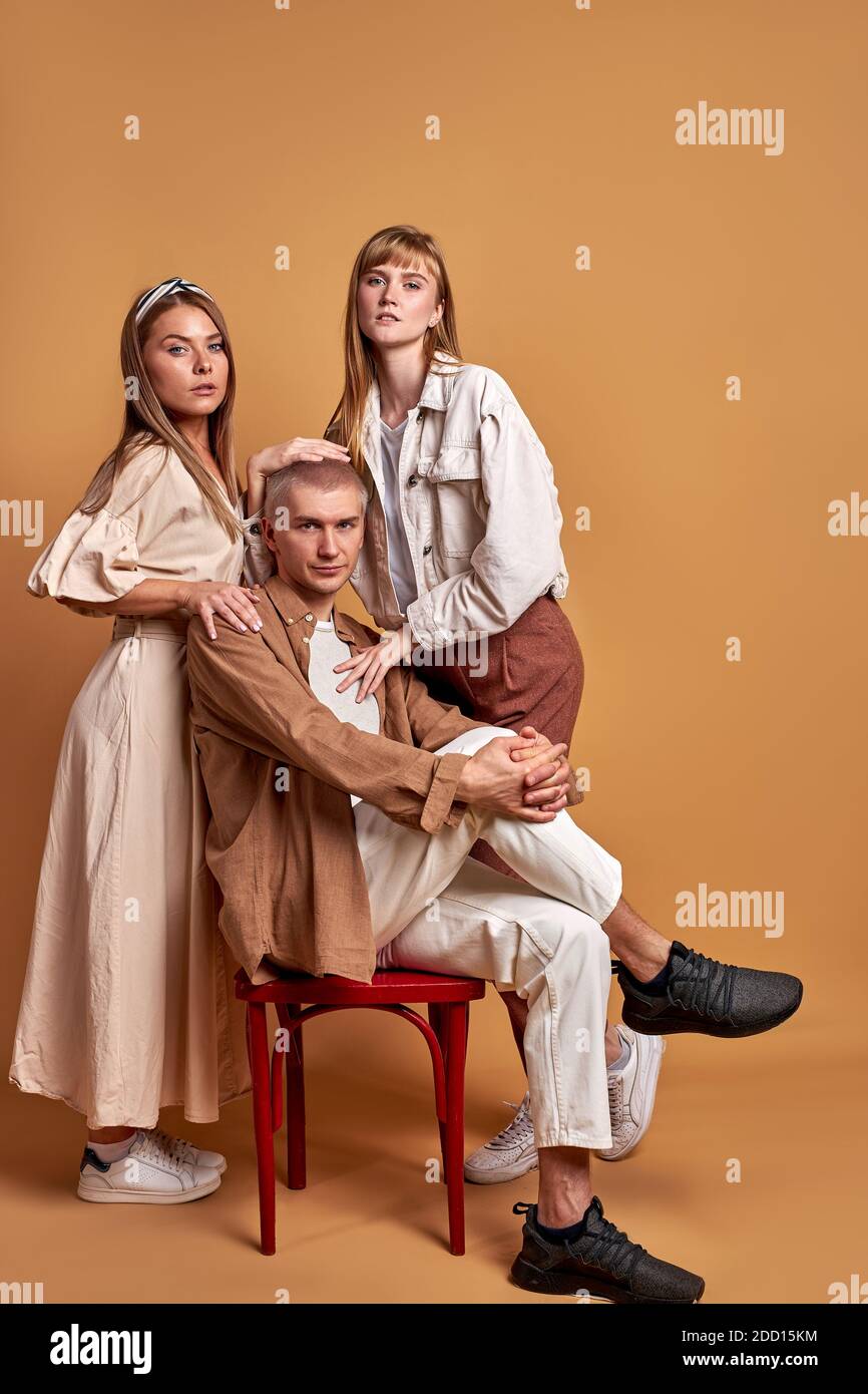 unusual group of extraordinary youth posing in trendy wear, caucasian ...