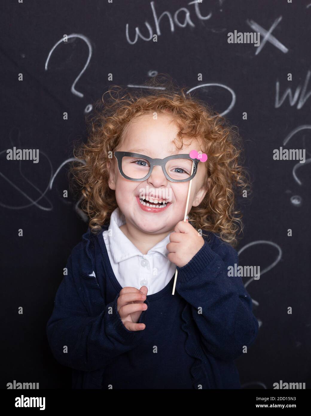 child toddler 3 year old dressed as a teacher and thinking with chalk ...