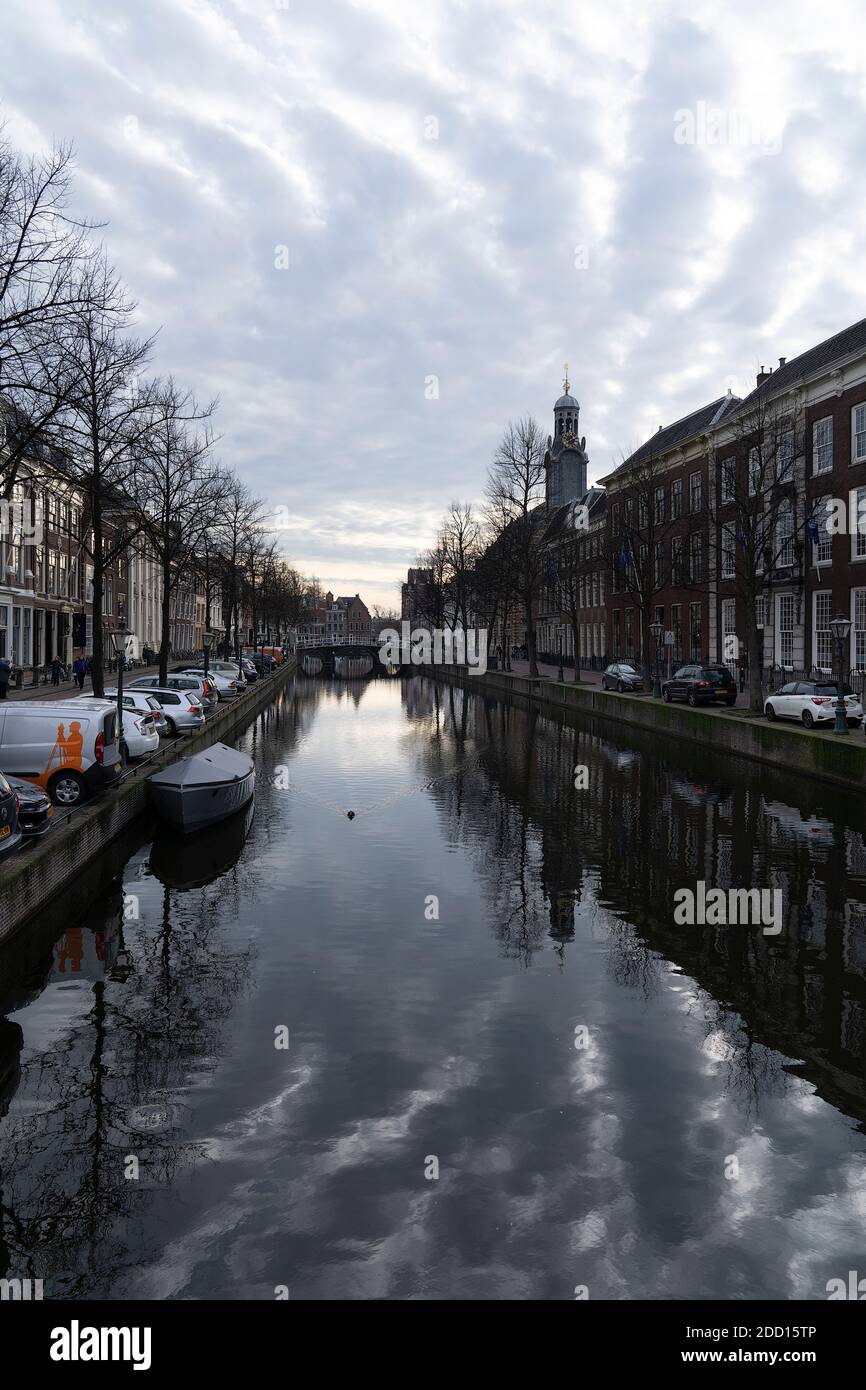 Canal with traditional houses in Leiden, The Netherlands at dusk on a ...