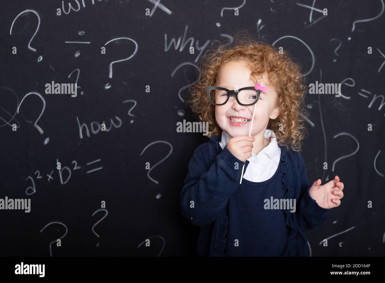 child toddler 3 year old dressed as a teacher and thinking with chalk ...