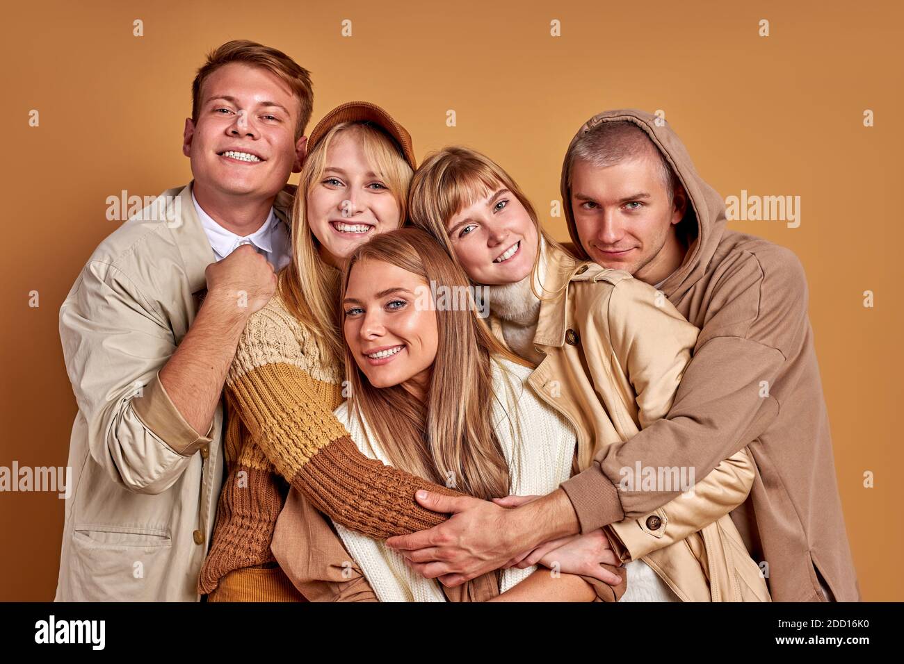 cheerful friends hugging isolated, people of caucasian european ...