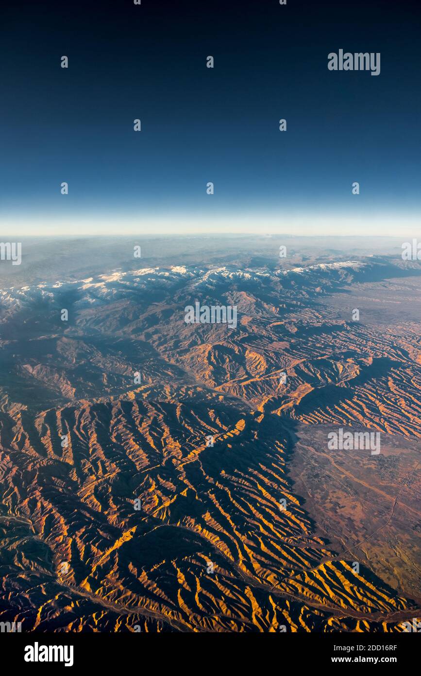 Aerial View from an Airplane. Flying above Beautiful Land at Sunrise ...