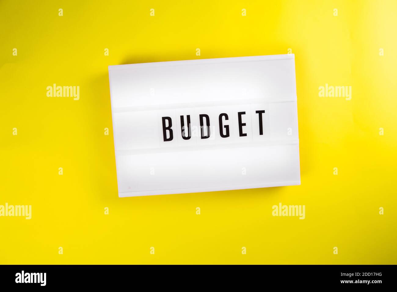 Budget word on lightbox, vintage billboard on yellow background Stock ...