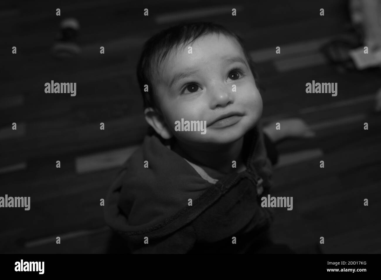 A top view closeup of a cute African American baby standing up and ...