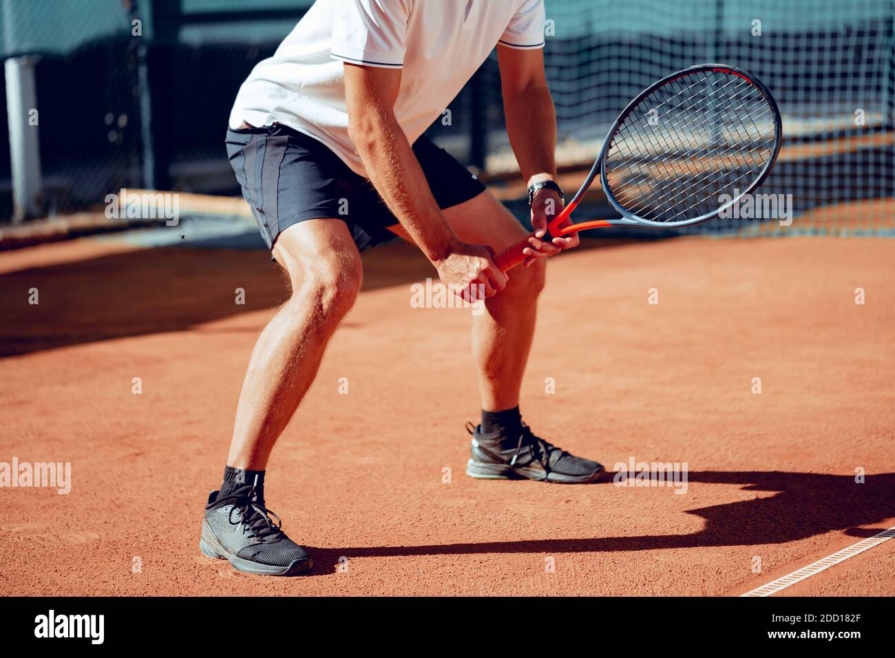 Tennis player standing in ready position on tennis court Stock Photo ...