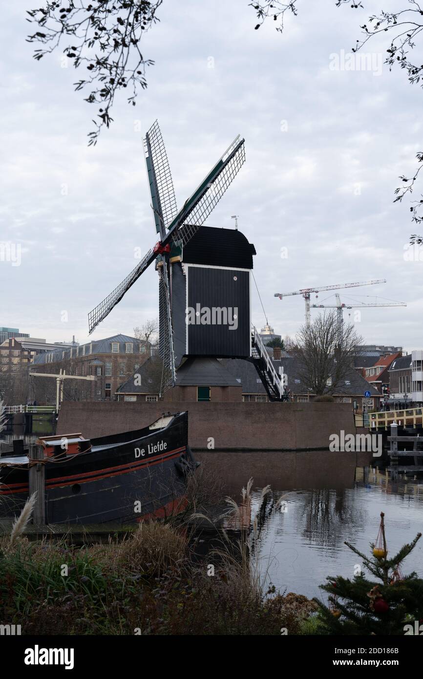 Dutch city Leiden in autumn. Windmill and old boat Stock Photo - Alamy