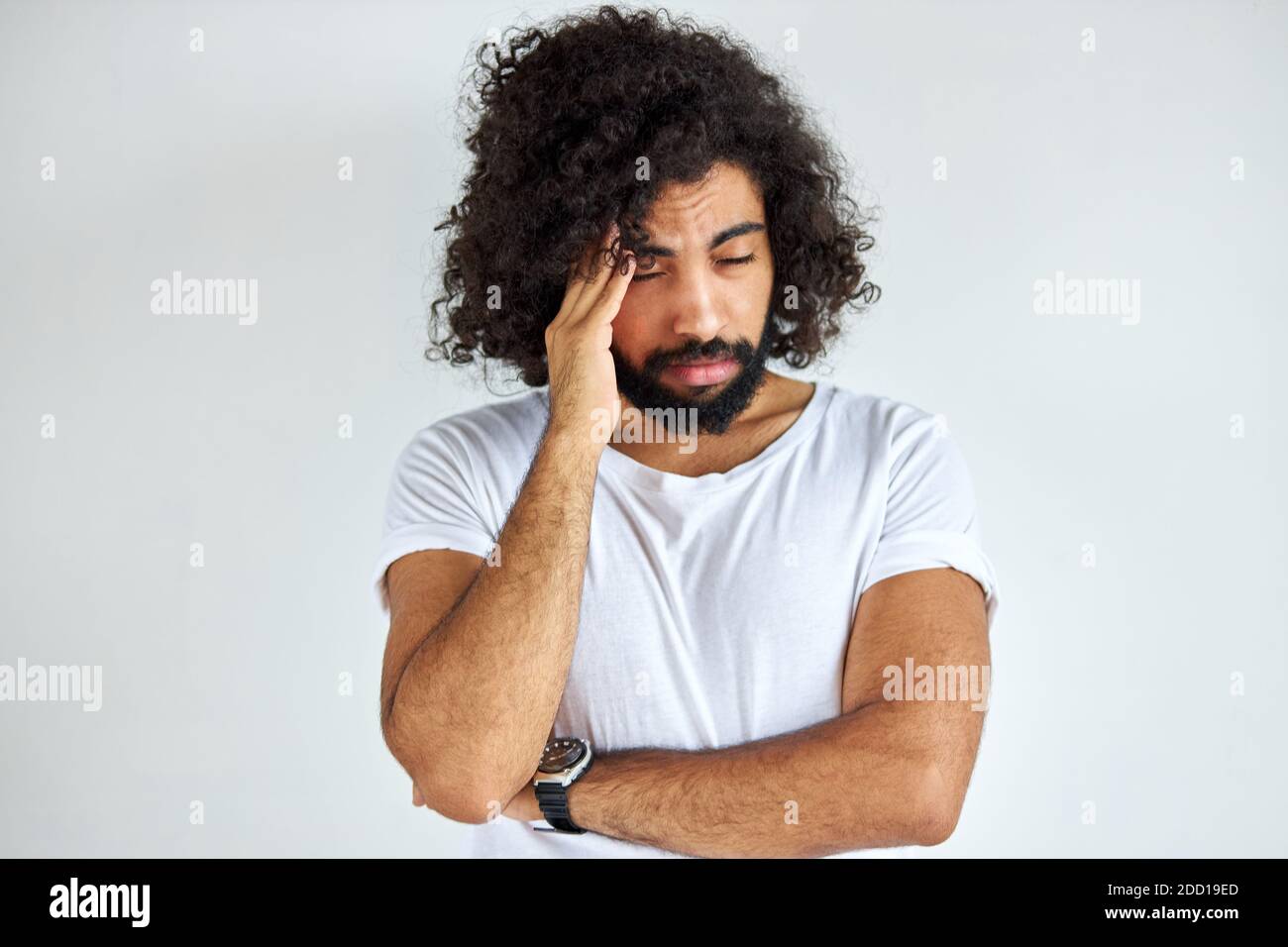 sad arabic man has problems, he is depressed, hold hand on head, stand ...