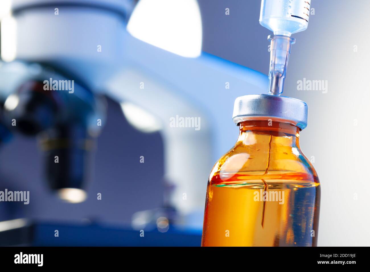 Medical vial with medication and syringe close up Stock Photo - Alamy