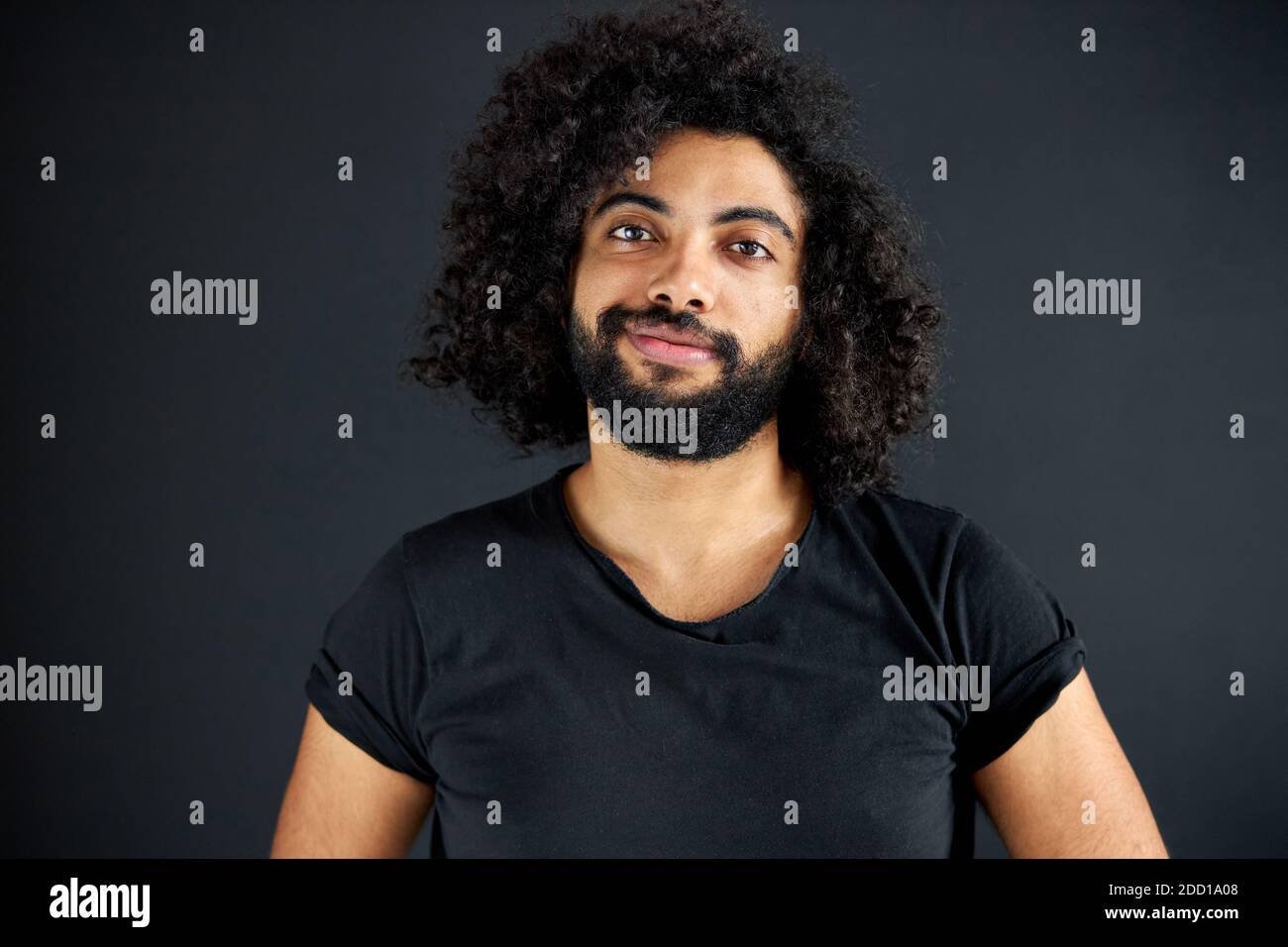 pleasant indian arabian male in shirt looking at camera, has friendly ...