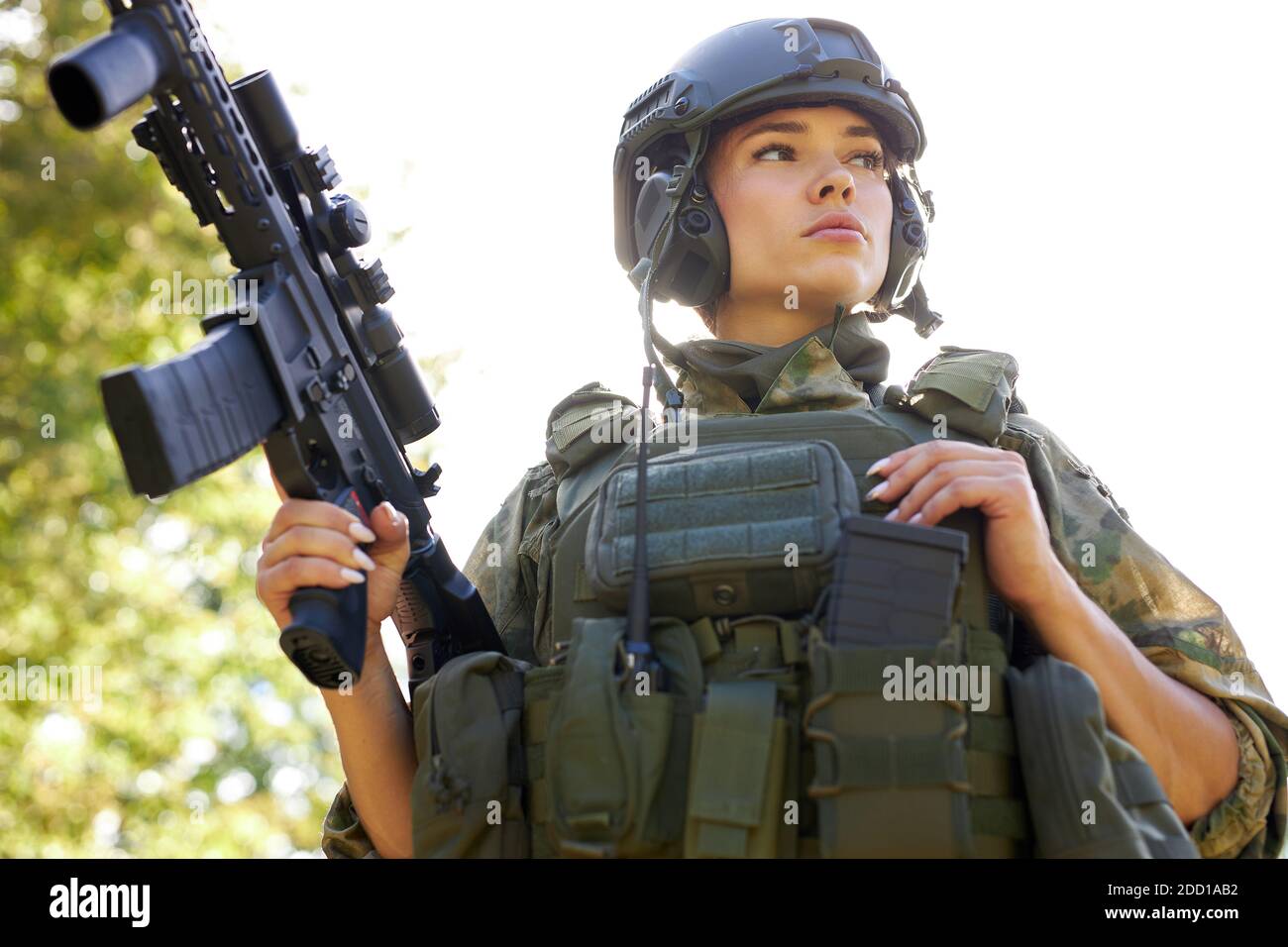 brave caucasian woman is engaged in hunting weapon gun or rifle ...