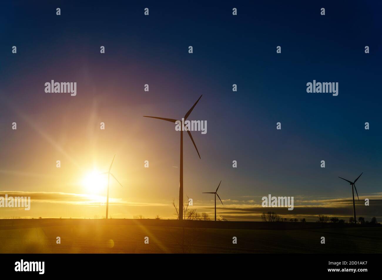 Wind power plants in sunlight. Toning Stock Photo - Alamy