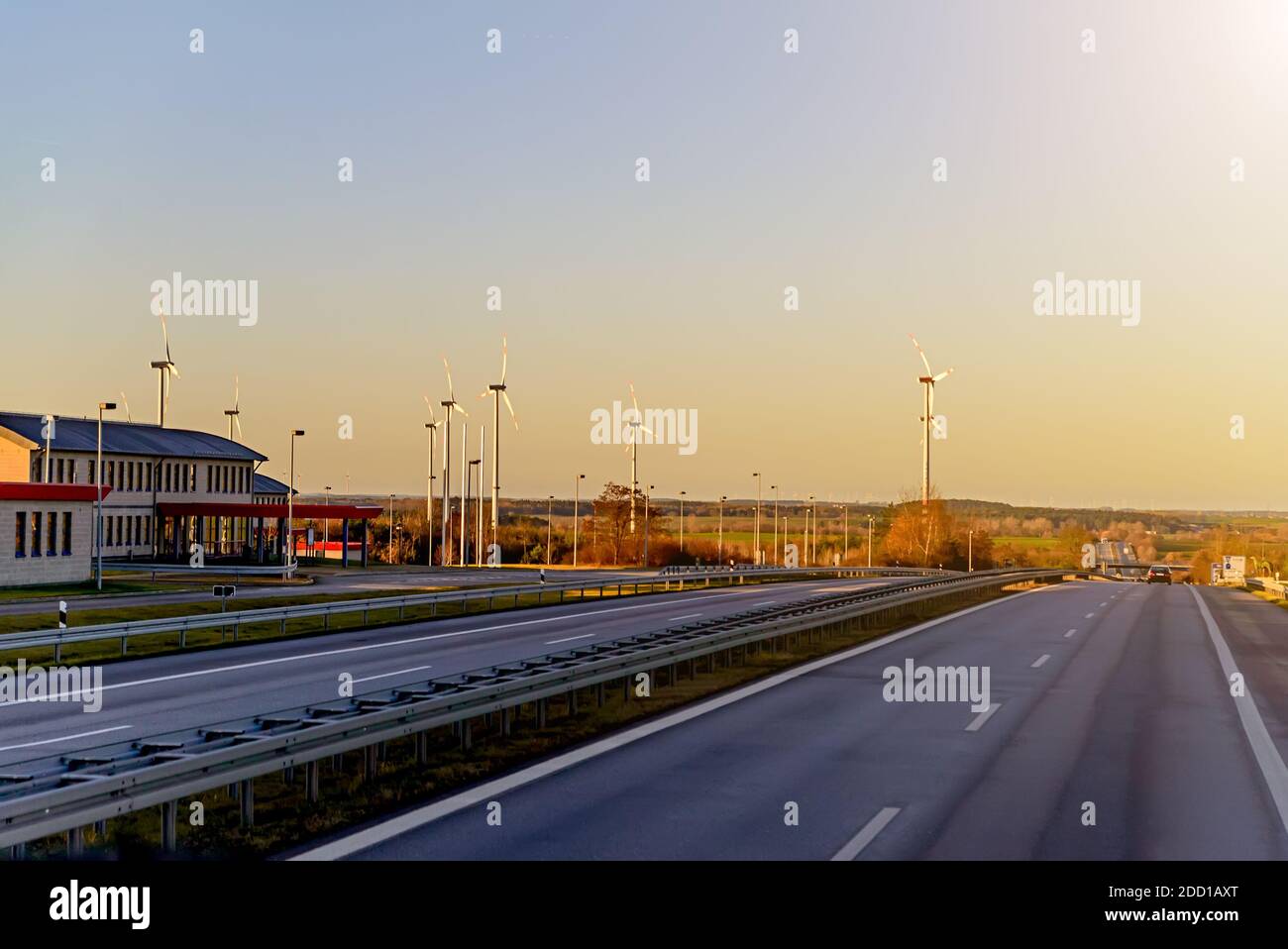 Wind turbines along the roadway Stock Photo - Alamy