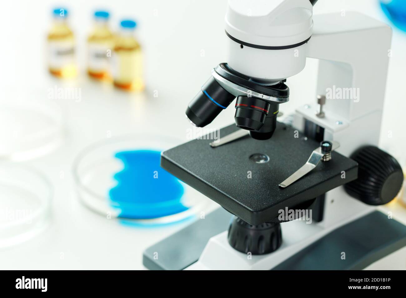 Microscope on the table with glassware in laboratory Stock Photo - Alamy