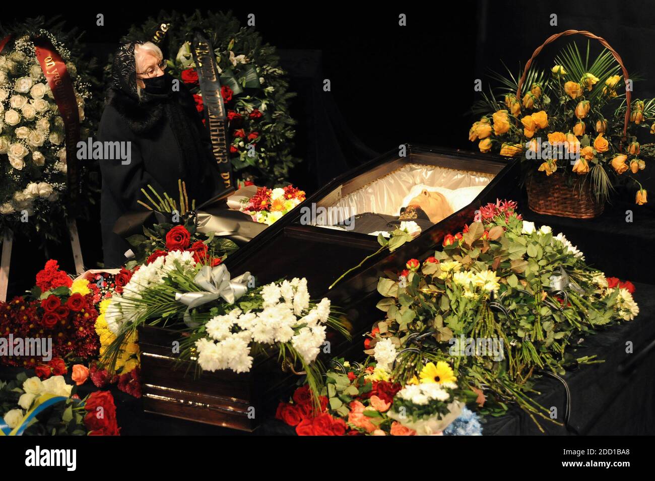 (EDITORS NOTE: Image depicts death)A woman pays respect to theater ...
