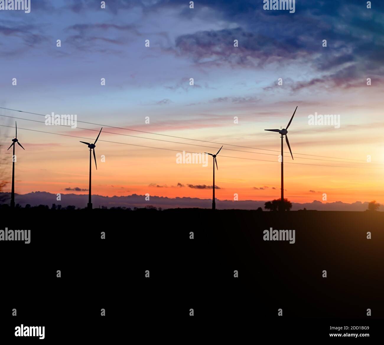 Wind power plants in sunlight. Toning Stock Photo - Alamy