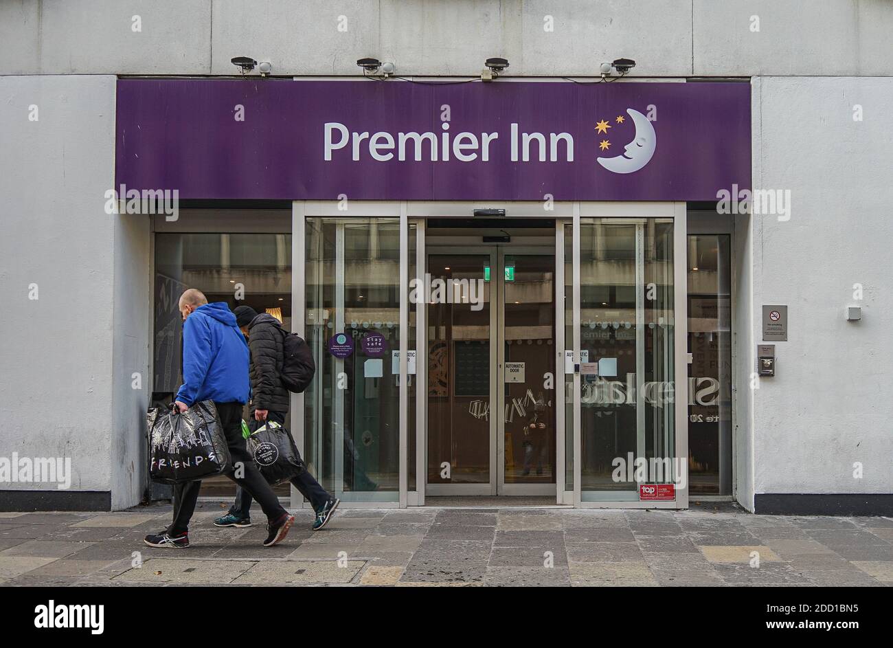 Guests are seen leaving the Premier Inn Hotel Stock Photo - Alamy
