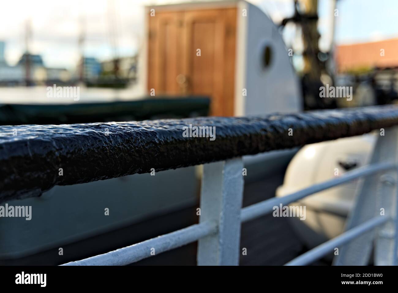 Old black iron handrail on the deck of an old passenger ship Stock ...
