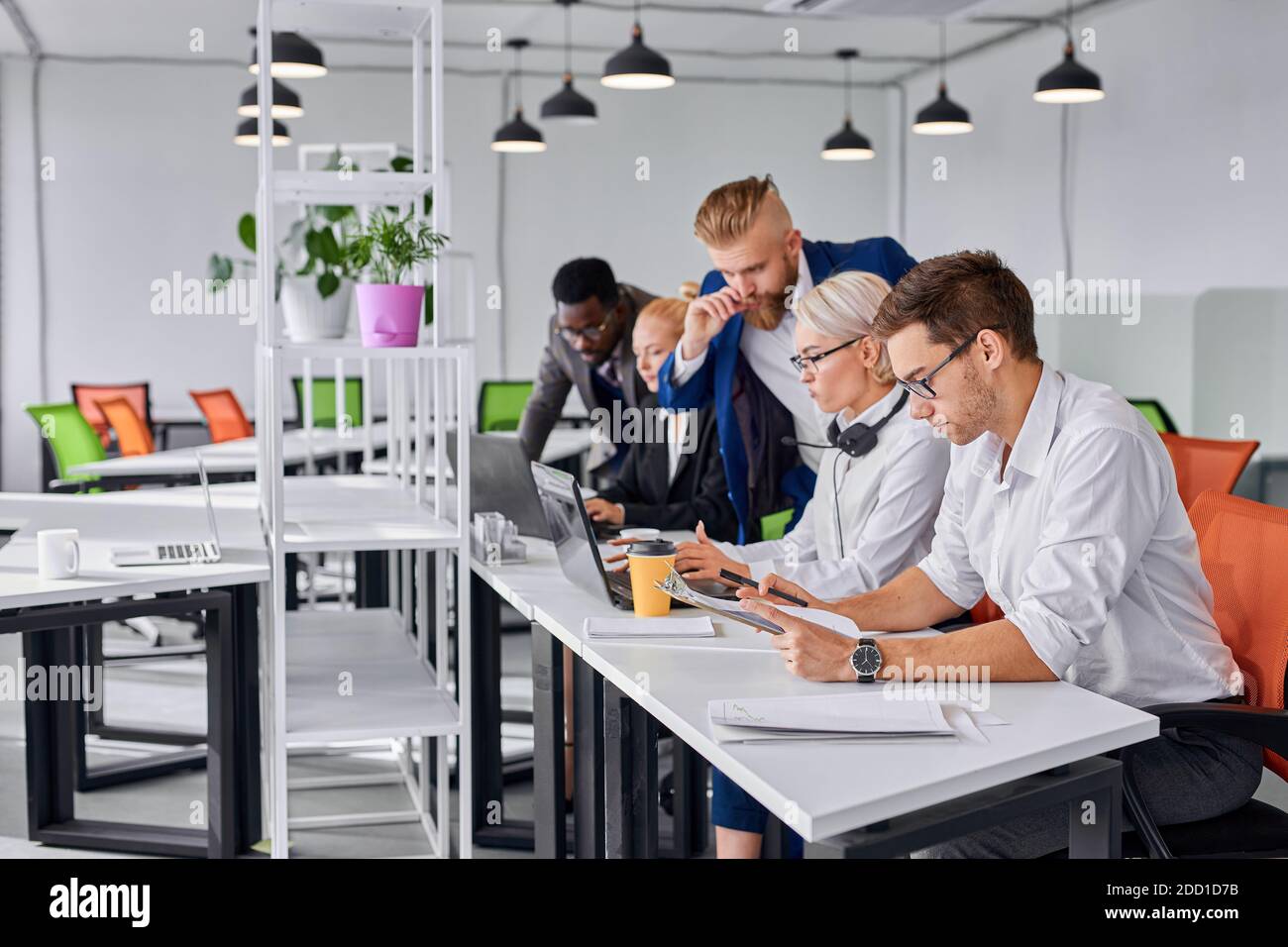 male director give directions to employees in the office, young team ...