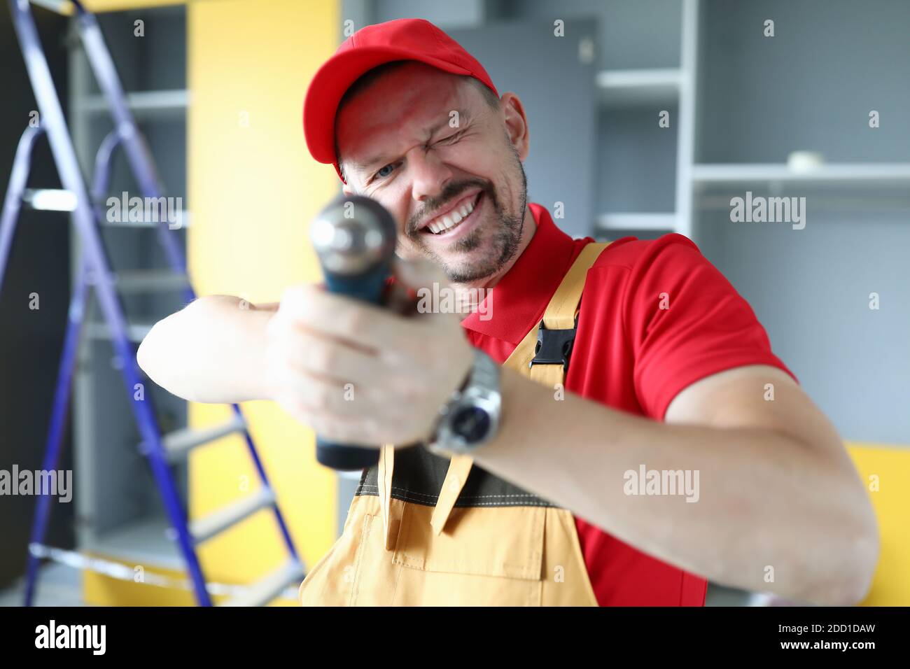 Happy professional repairman at work Stock Photo - Alamy